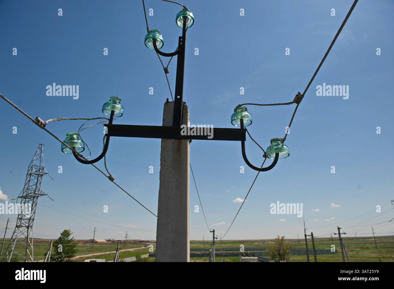 High-voltage power lines with insulators, stabilizers and transformers ...