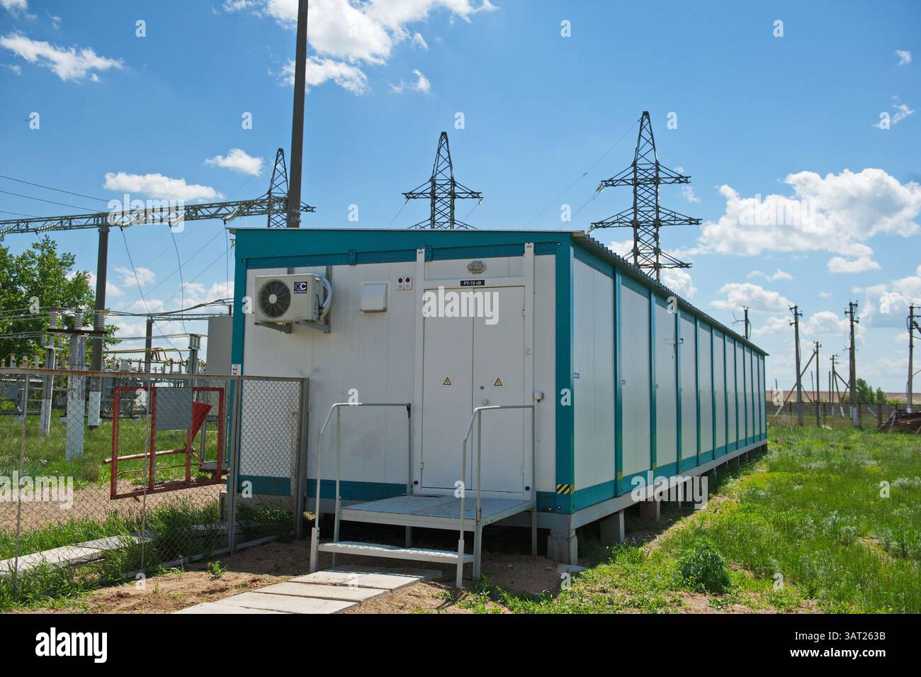 High-voltage power lines with insulators, stabilizers and transformers ...