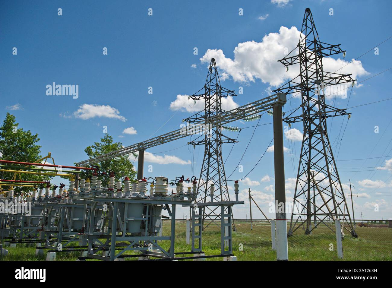 High-voltage power lines with insulators, stabilizers and transformers ...