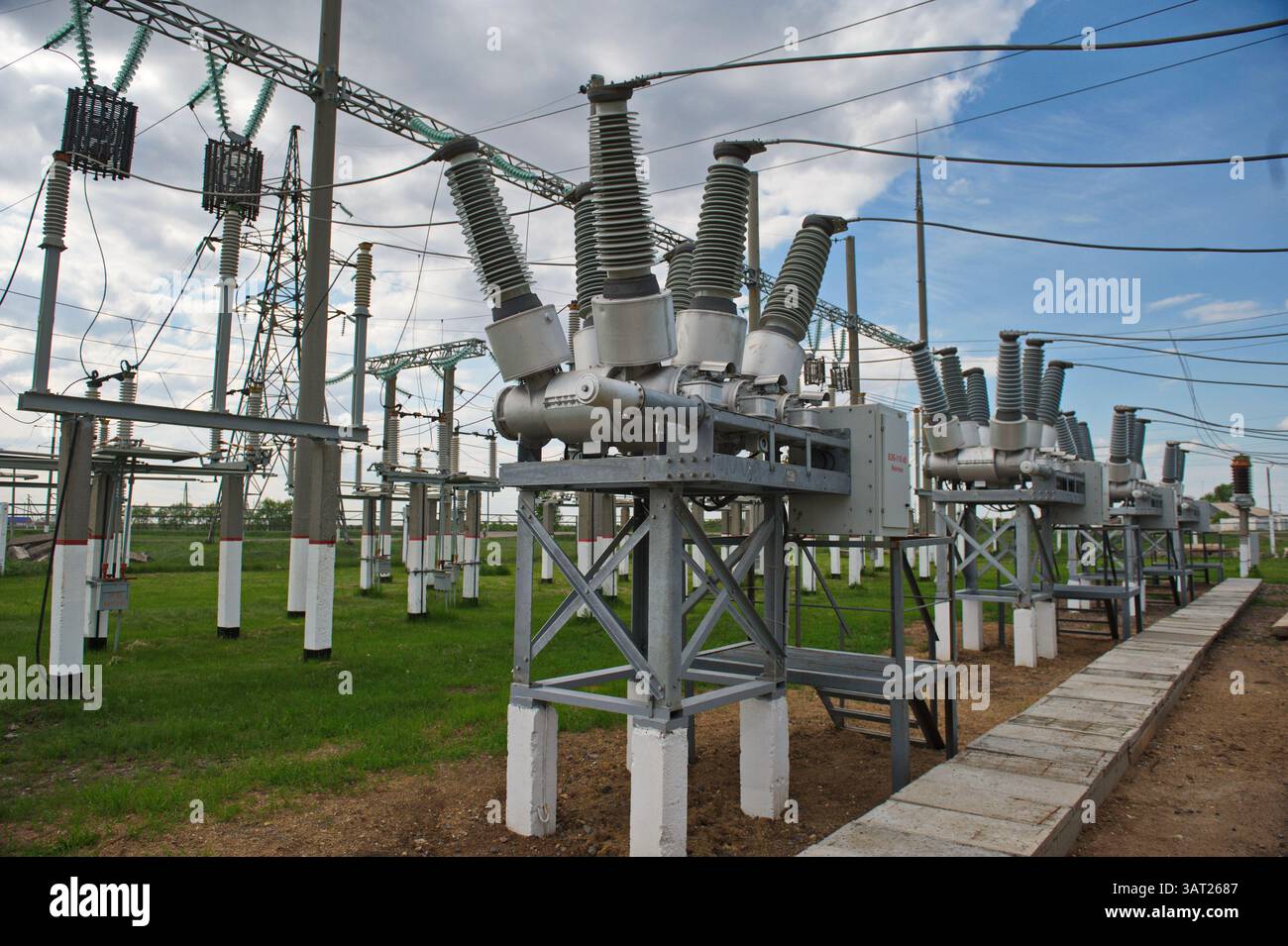 High-voltage power lines with insulators, stabilizers and transformers ...