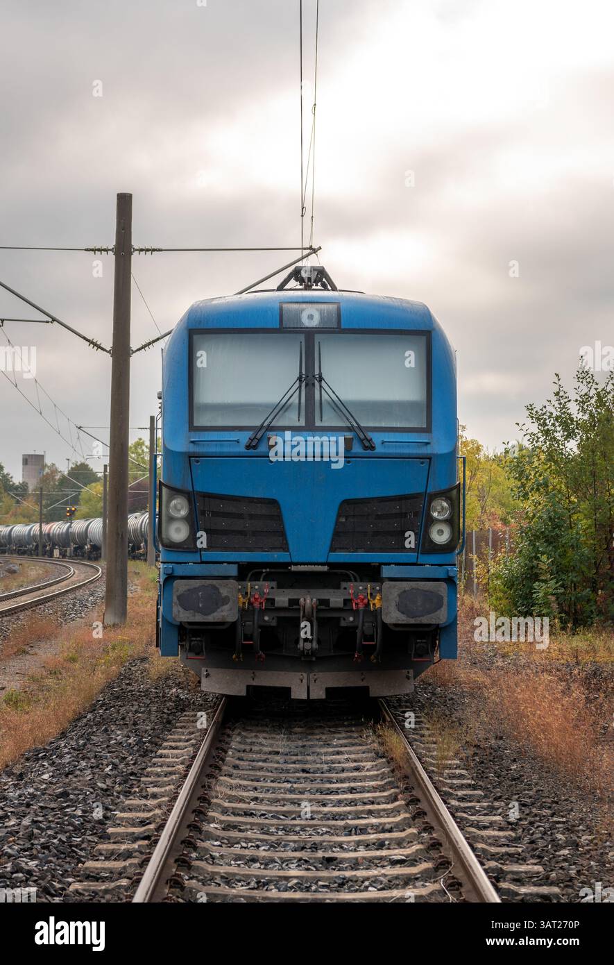 Front view close-up of an electric train locomotive transporting fuel ...