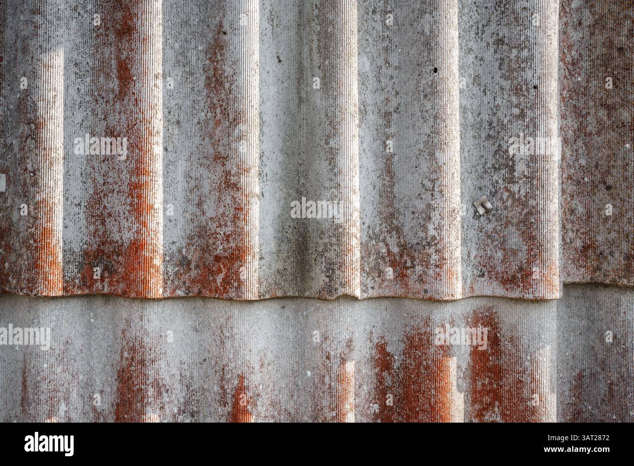 Old and very dangerous asbestos roof. Asbestos dust in the environment ...