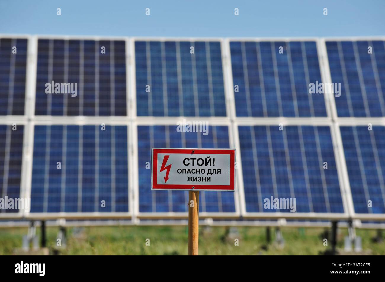 Warning sign in Russian: Stop. Life-threatening. Solar station Stock ...