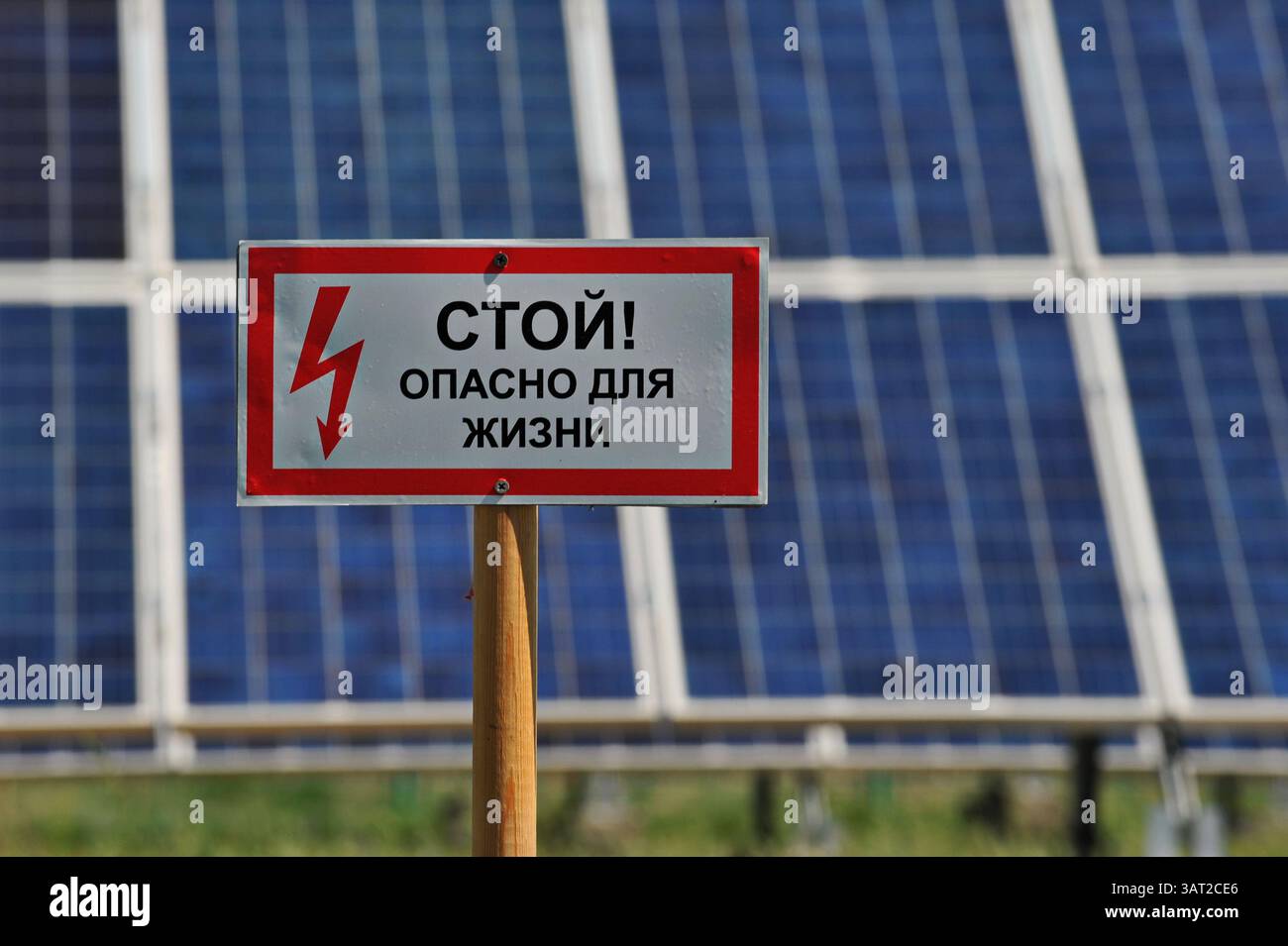 Warning sign in Russian: Stop. Life-threatening. Solar station Stock ...