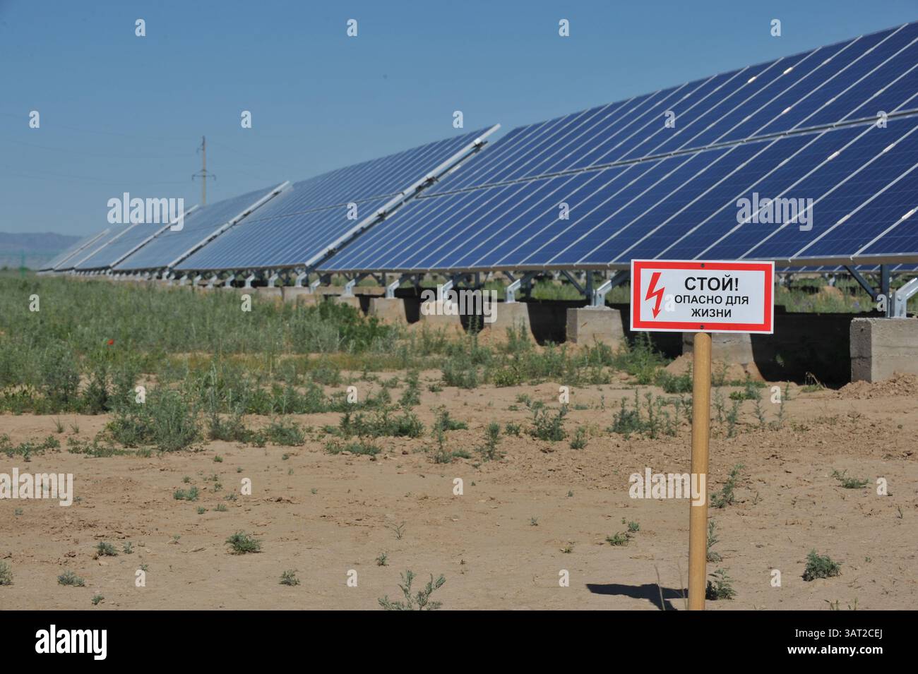 Warning sign in Russian: Stop. Life-threatening. Solar station Stock ...