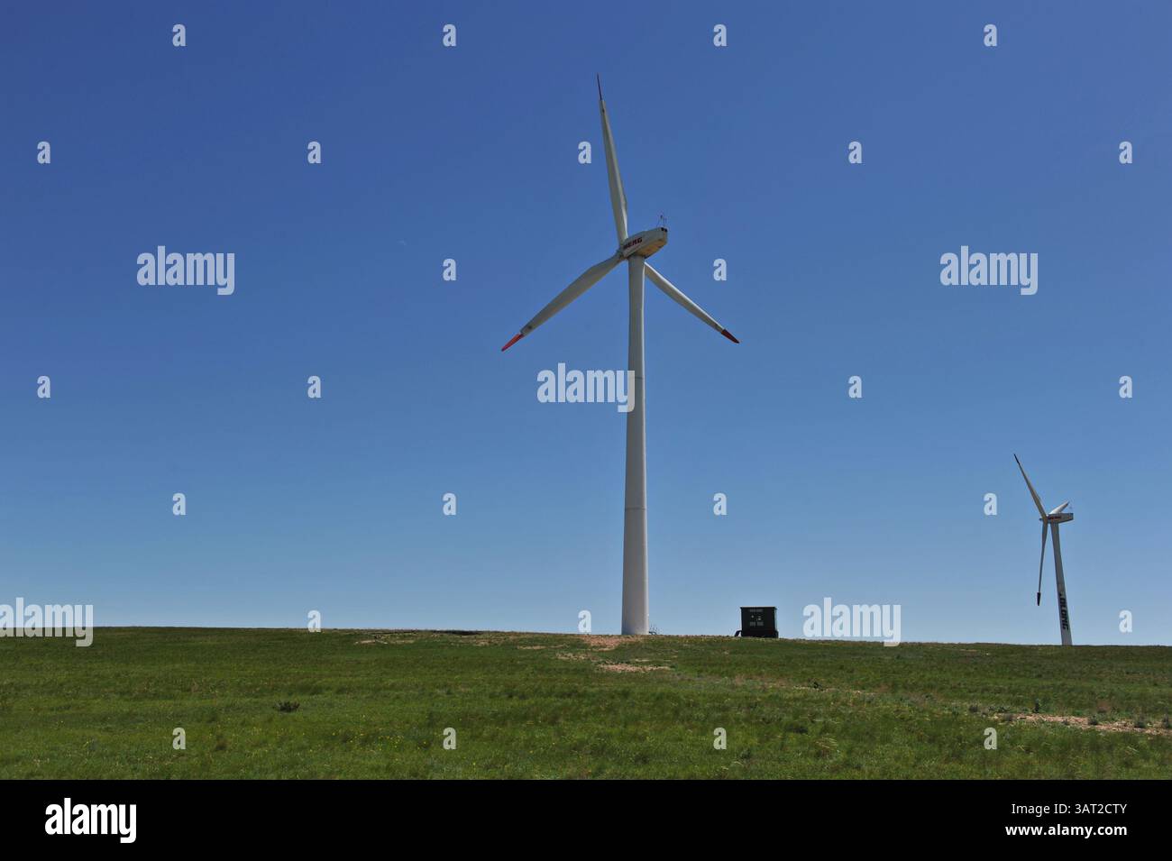 Wind turbines located in an open hilly area to collect energy Stock ...