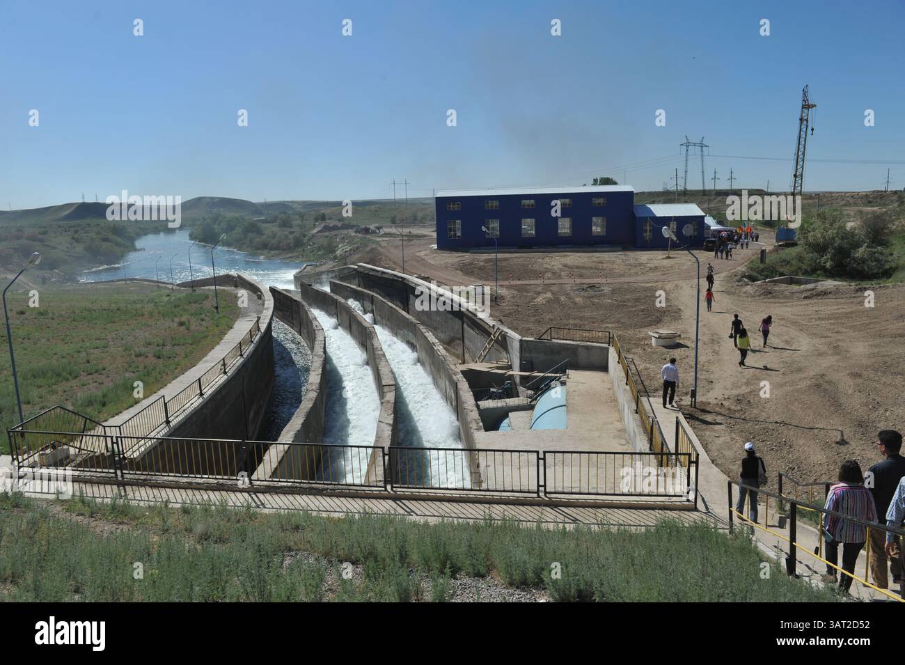 Dam water discharge bay on the background of the main building of the ...