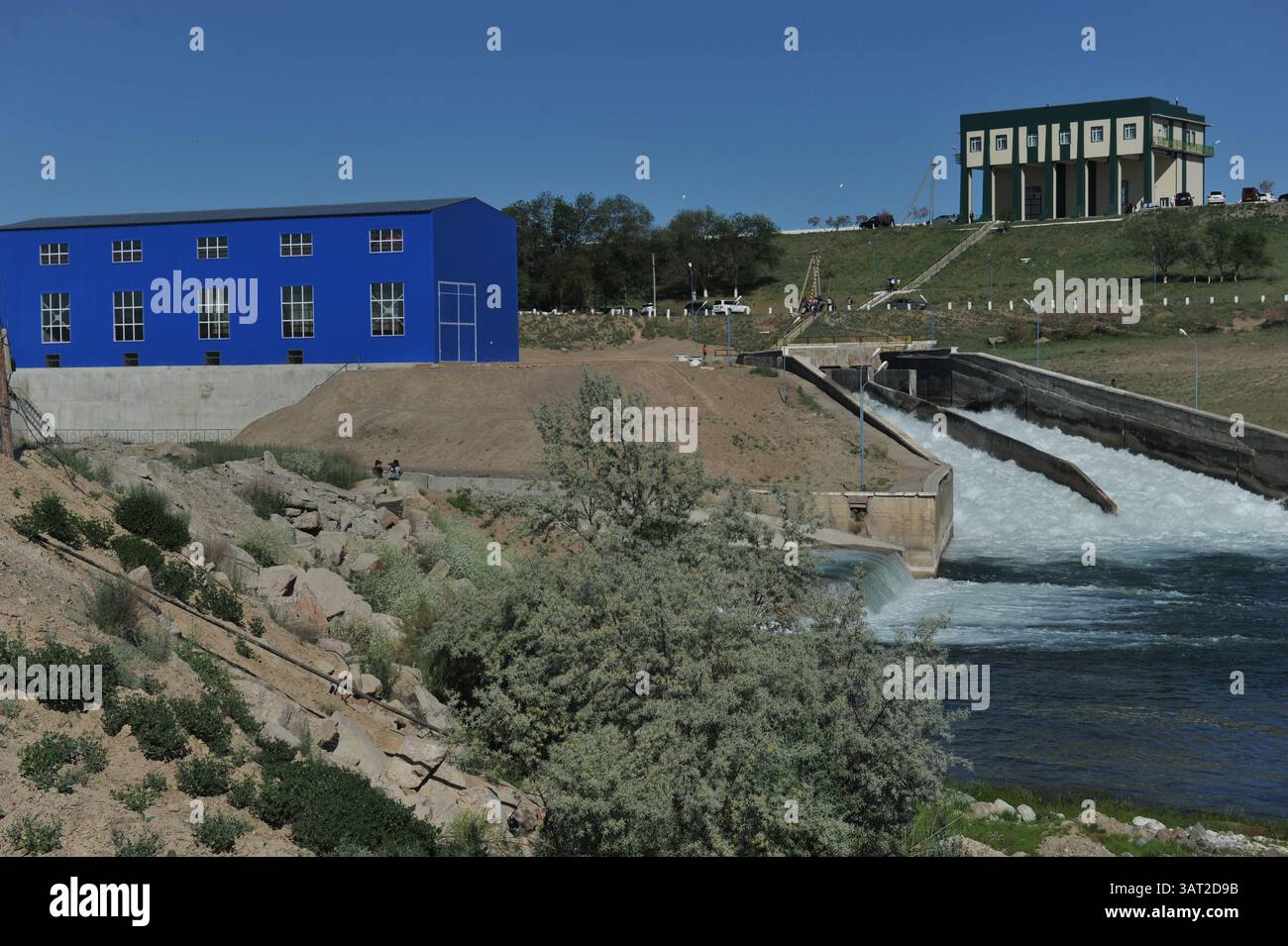 Dam water discharge bay on the background of the main building of the ...