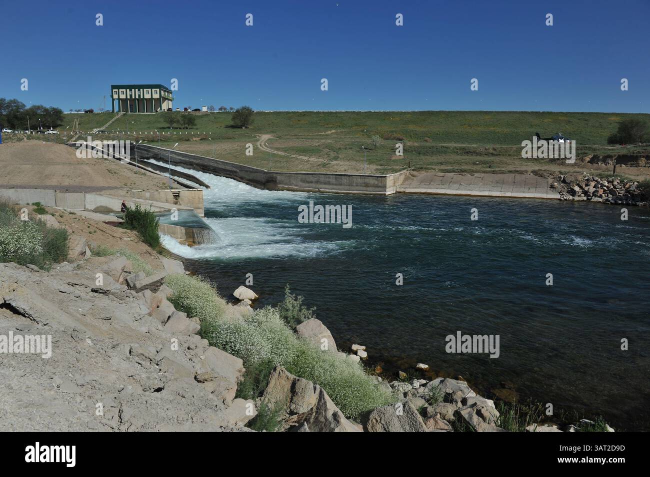 Dam water discharge bay on the background of the main building of the ...