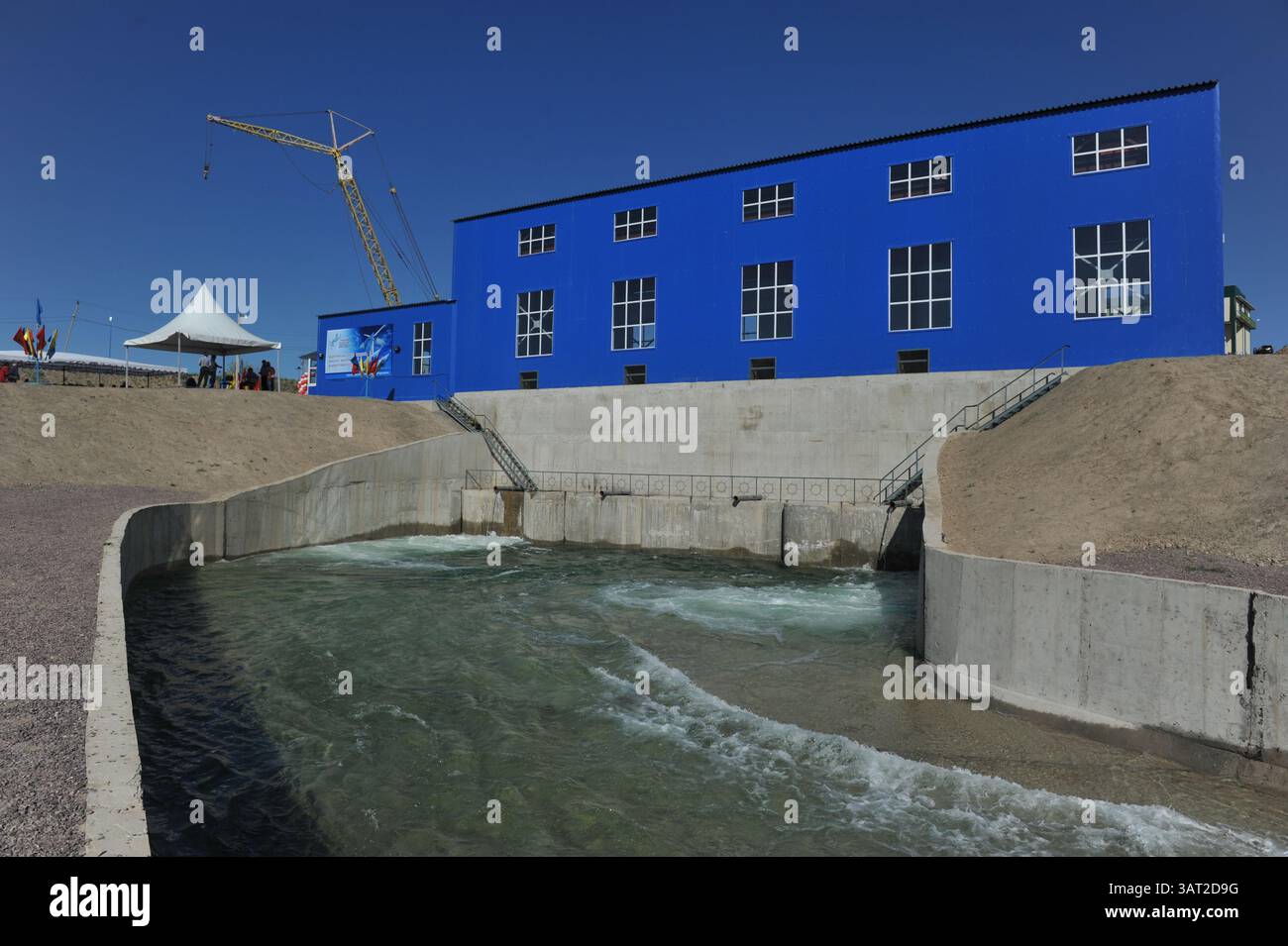 Dam water discharge bay on the background of the main building of the ...