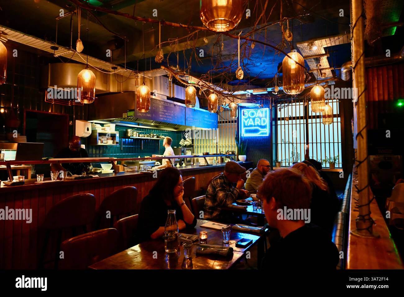 customers dining and drinking at boat yard fish restaurant in heist ...