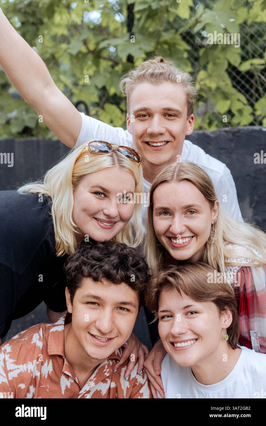 Group of cheerful friends smiling in summer outdoors Stock Photo - Alamy