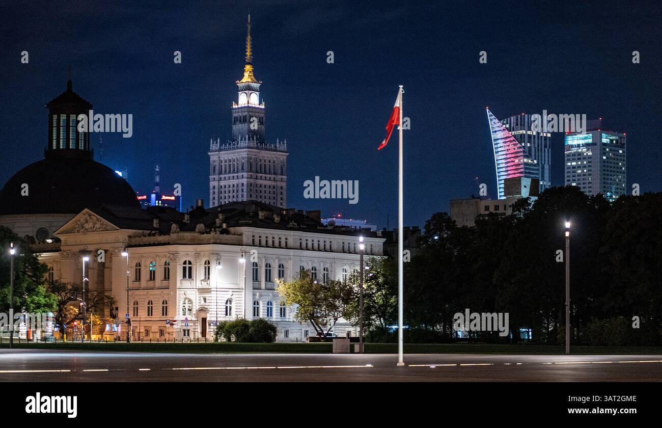 A night view of Warsaw, Poland, showcasing the iconic Palace of Culture ...