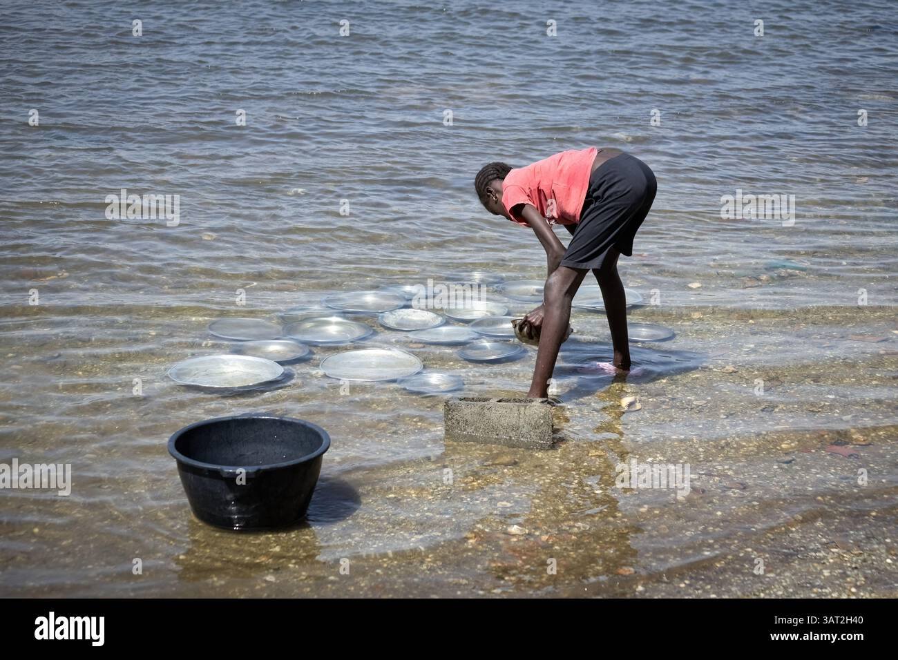 Washing dishes in the river hi-res stock photography and images - Alamy