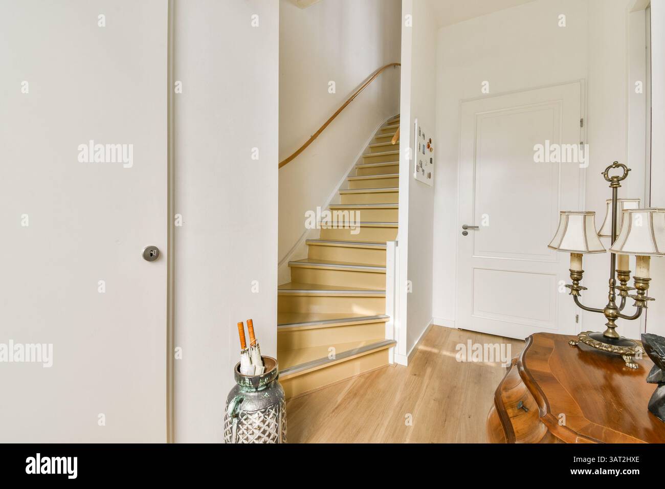 A beautifully designed modern staircase featuring smooth wooden steps ...