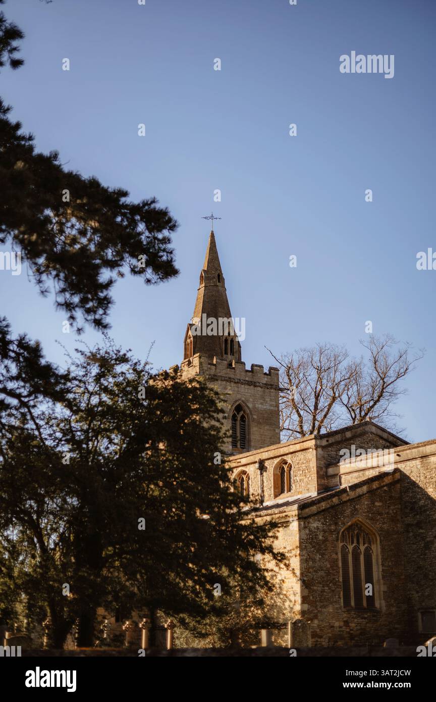 Old English Church and cemetery through tree branches Stock Photo - Alamy
