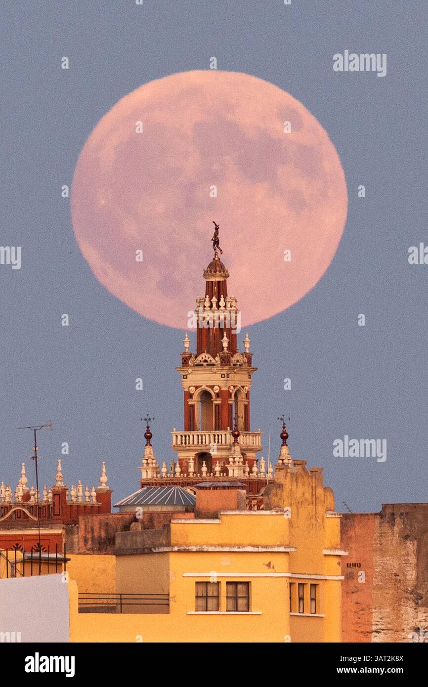 symmetrical super moon with statue Stock Photo - Alamy