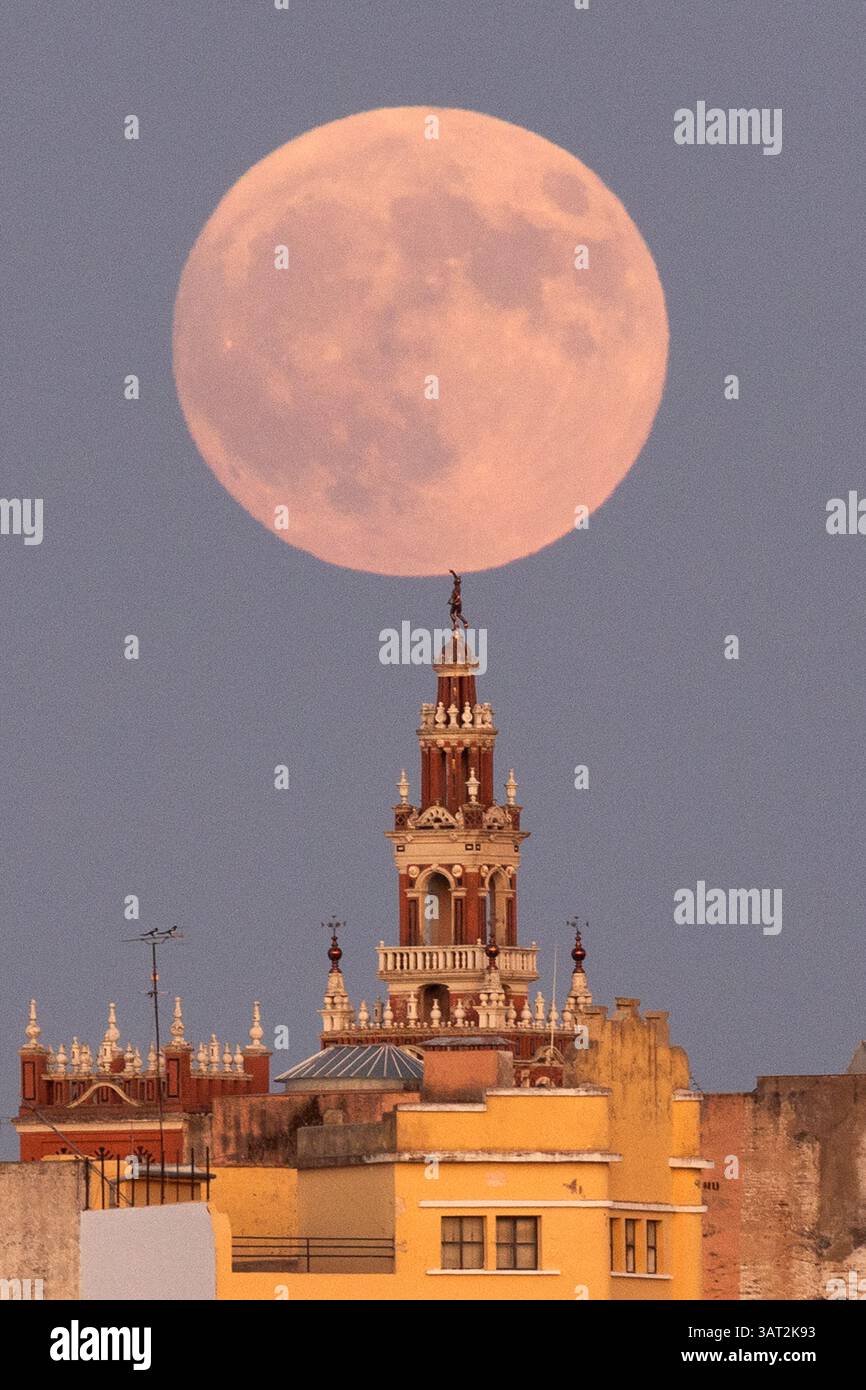 symmetrical super moon with statue Stock Photo - Alamy