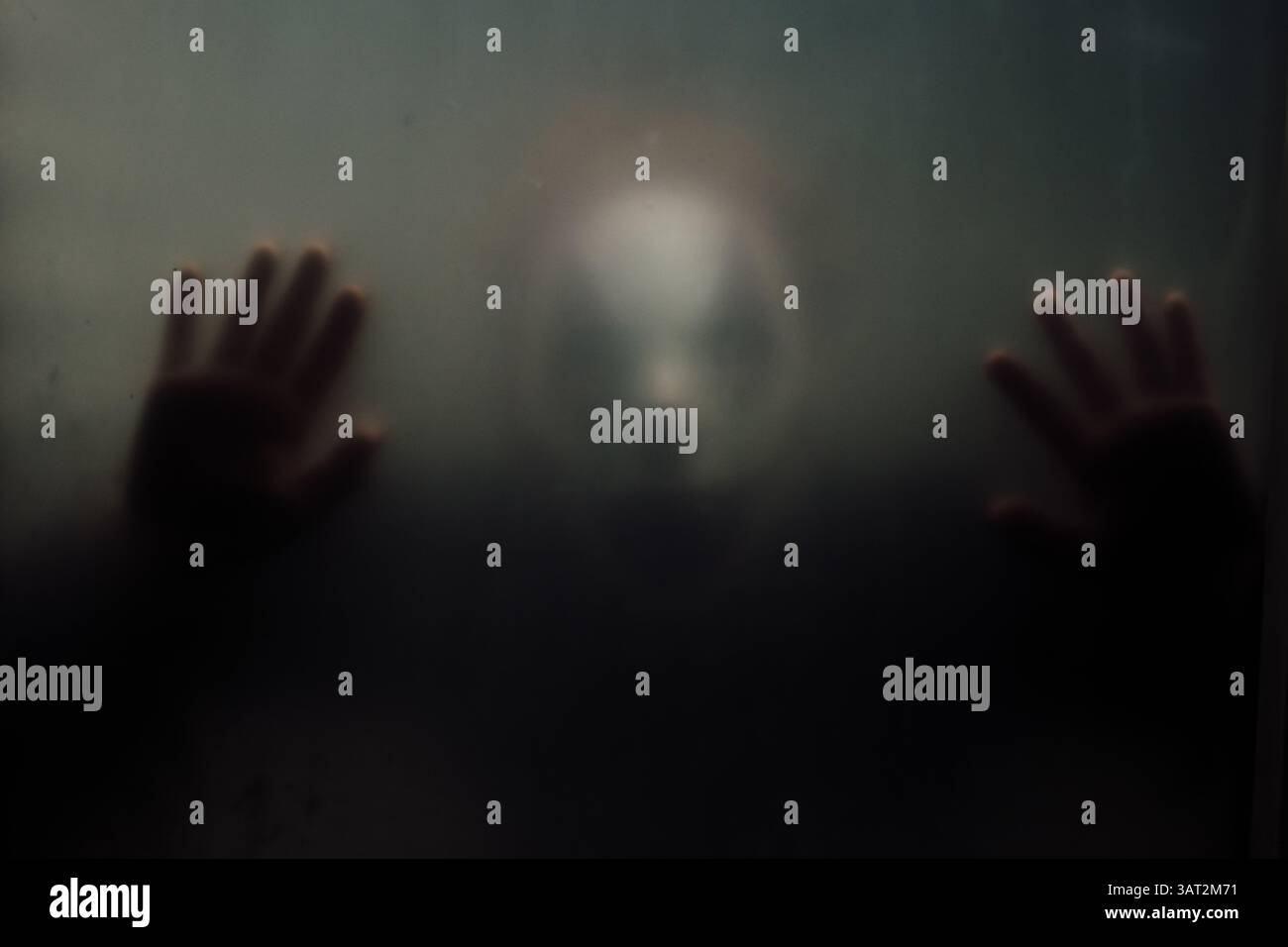 Terrifying clown pressed up against a foggy window looking in Stock ...