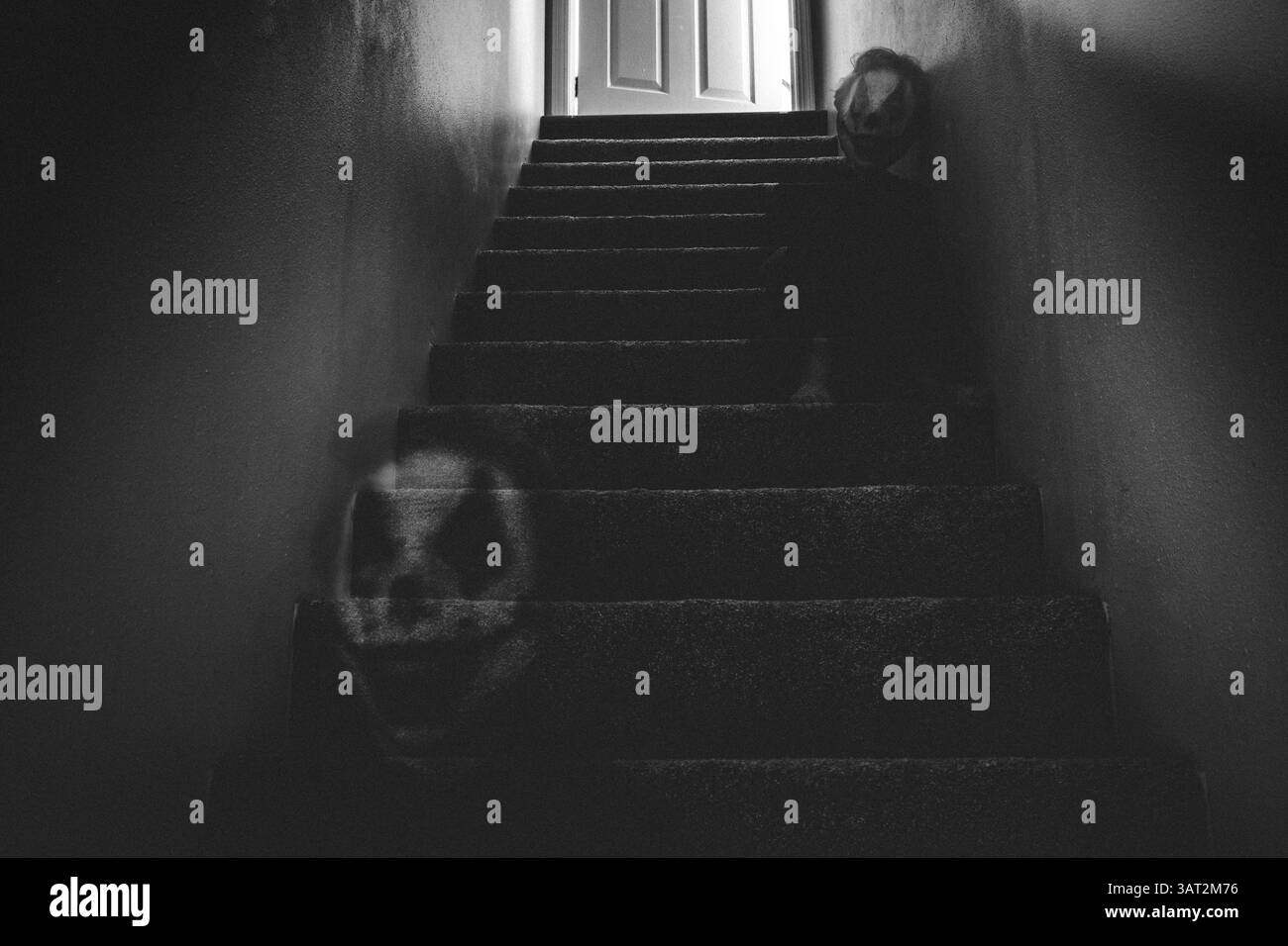 Long exposure of spooky clowns sitting on creepy staircase Stock Photo ...