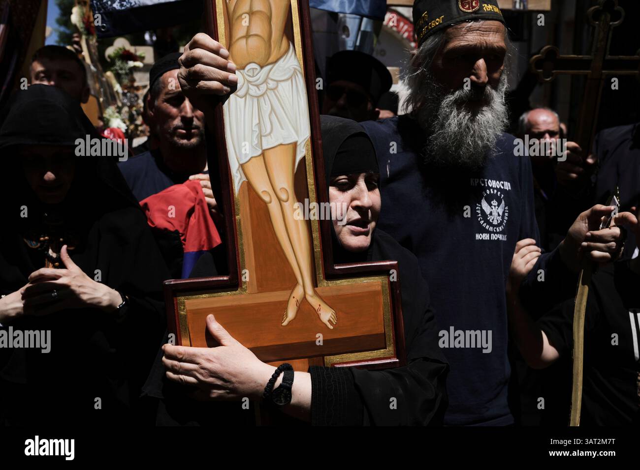 Christian pilgrims carry crosses during Good Friday procession in the ...