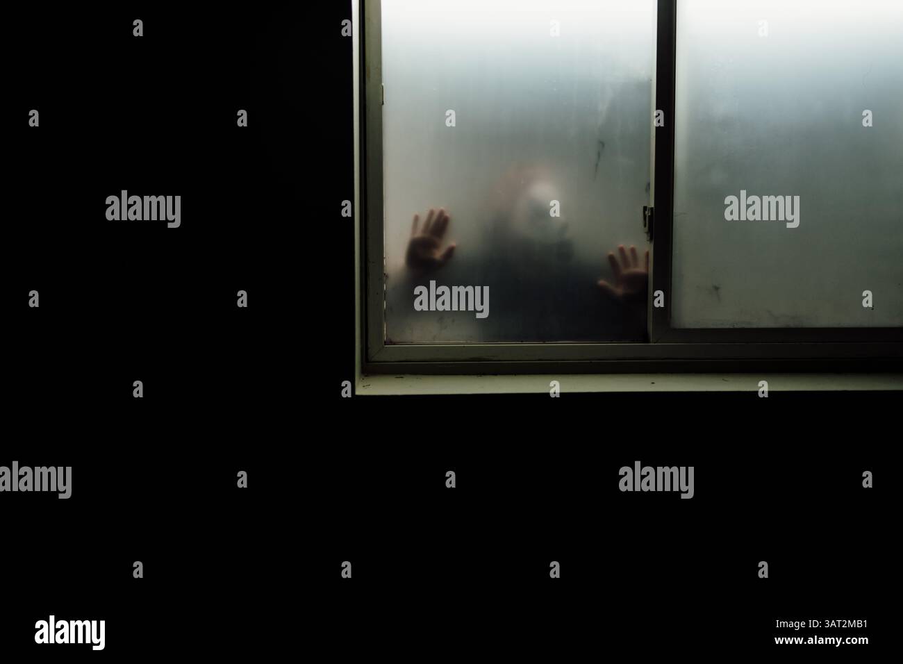 Creepy clown looks to unlock foggy window from the outside of home ...