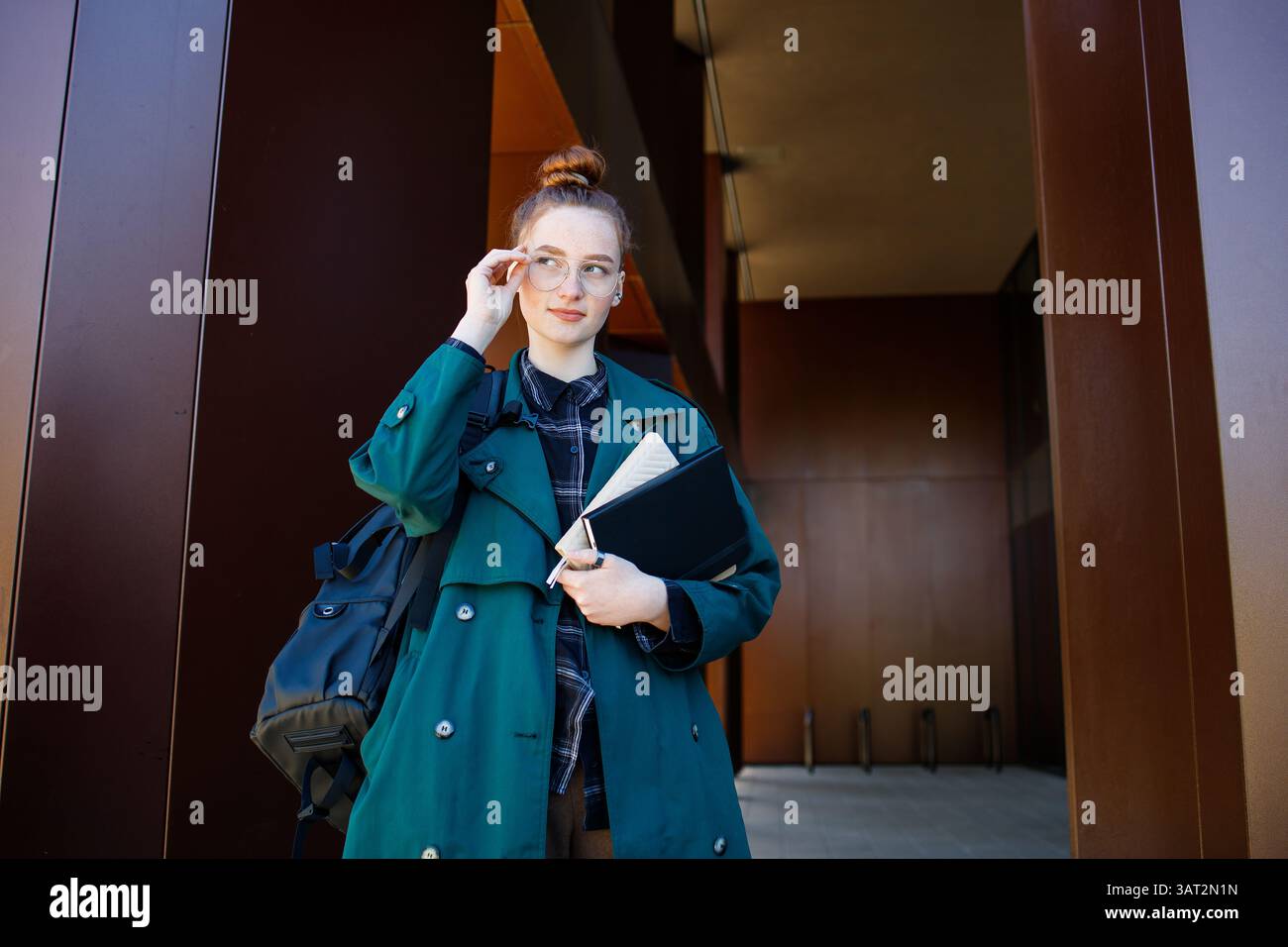 Student ginger girl at modern university campus building Stock Photo ...