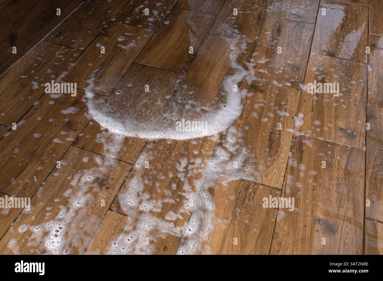 Terrace on the veranda flooded with water, washing tiles on the terrace ...