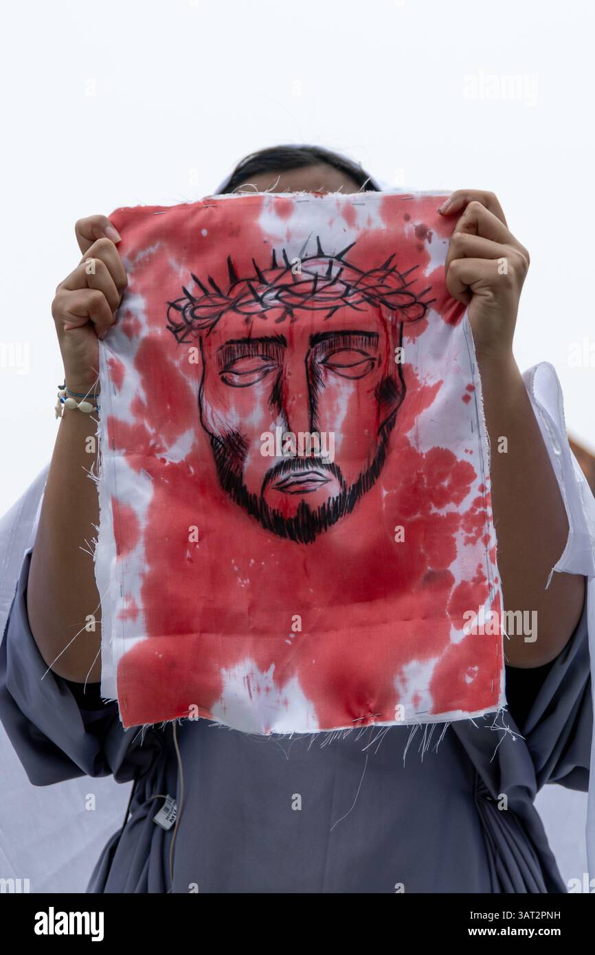 Actor portraying Mother Mary presents the Shroud of Turin, the cloth ...