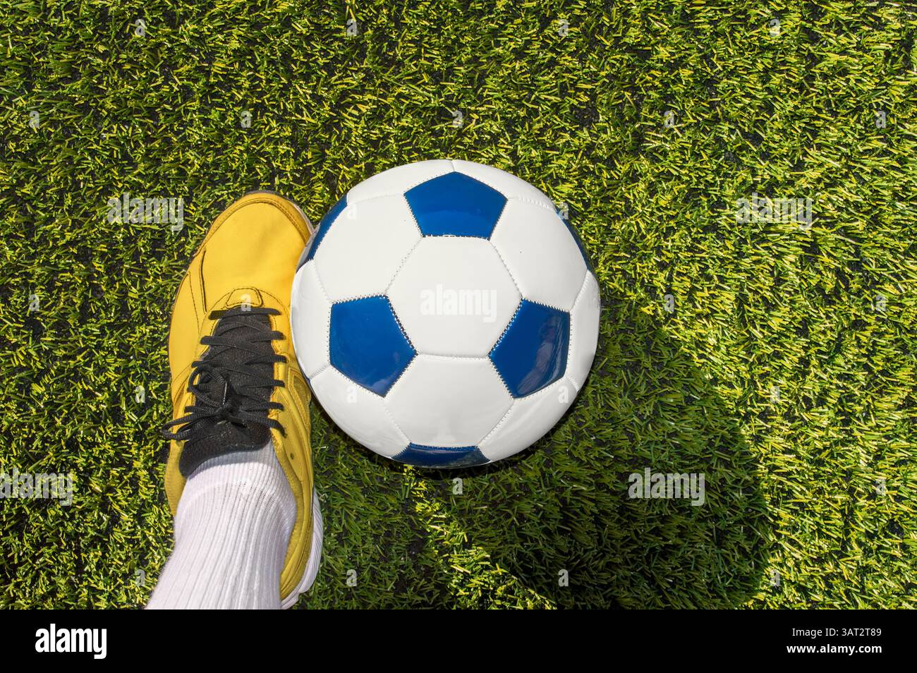 Top view soccer ball with his feet on the football field Stock Photo ...