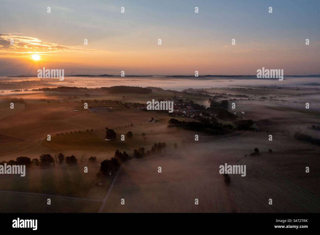 German rural scenery, drone aerial view, in the morning at golden hour ...
