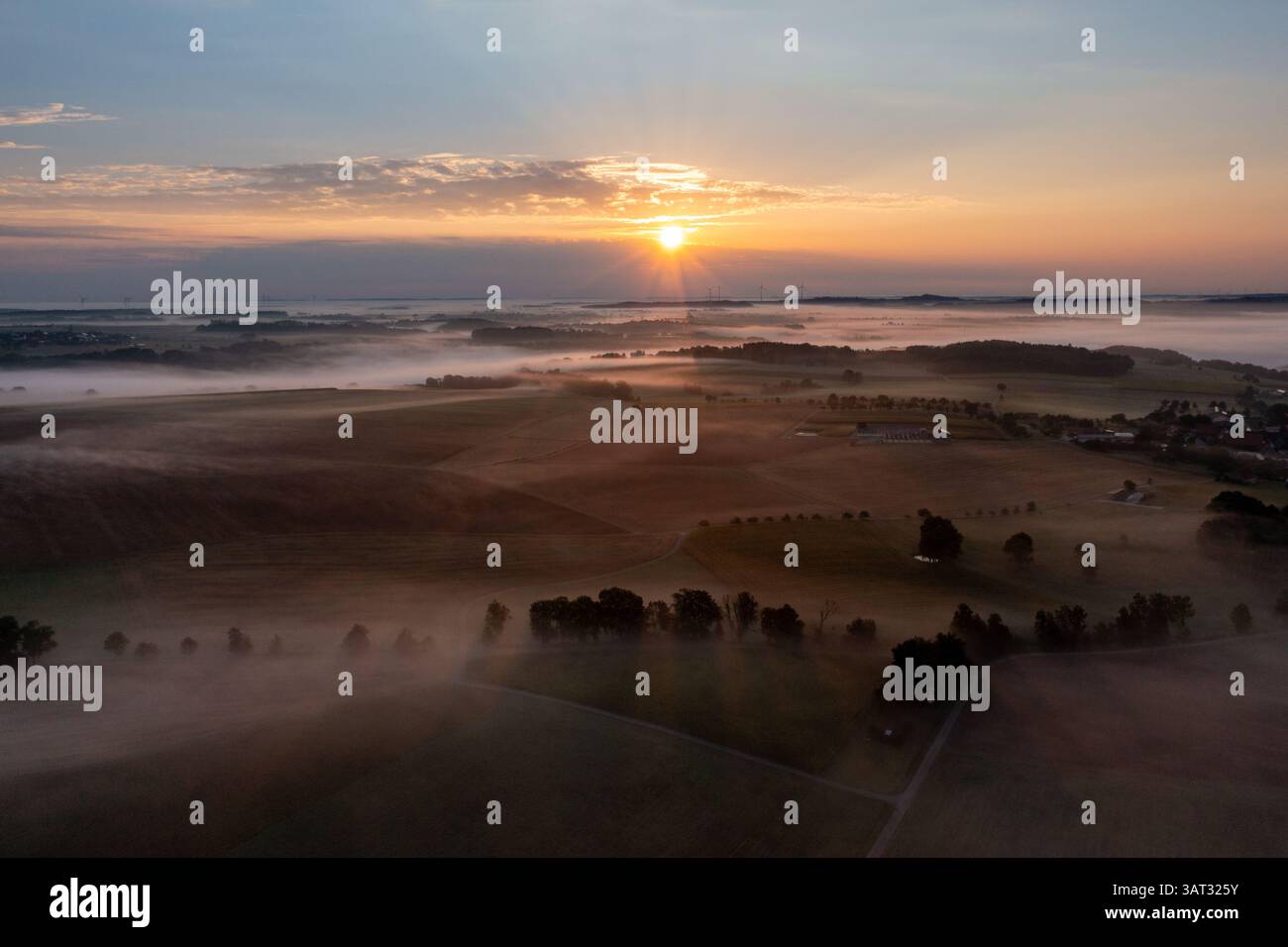 German rural scenery, drone aerial view, in the morning at golden hour ...