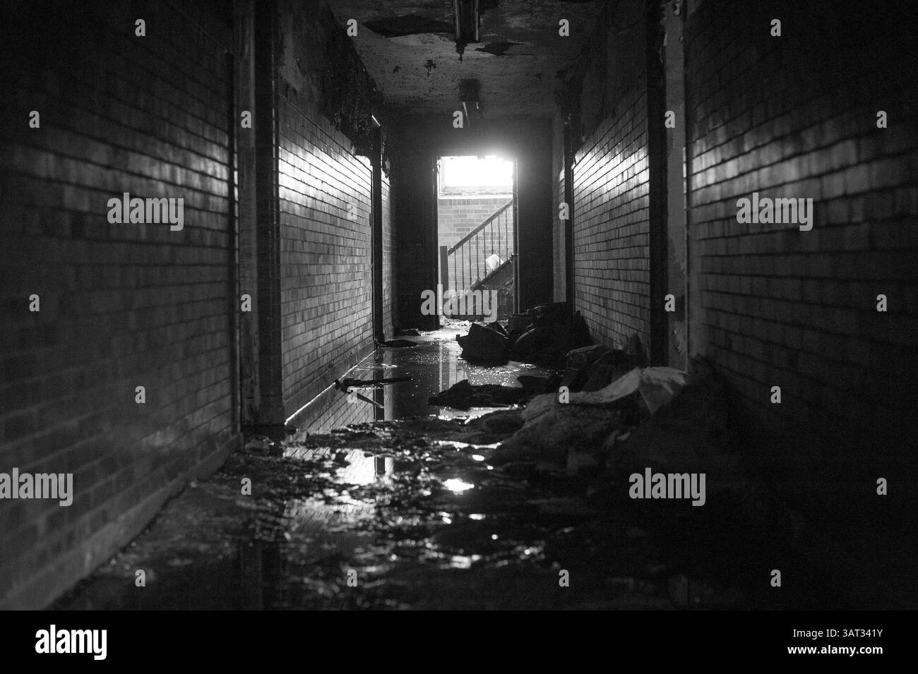 Garbage and sewage in a basement hallway in a abandoned Municipal ...