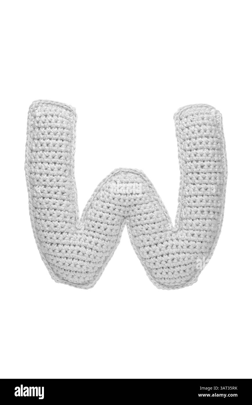 Handmade crocheted letter W in light grey yarn, isolated on white ...