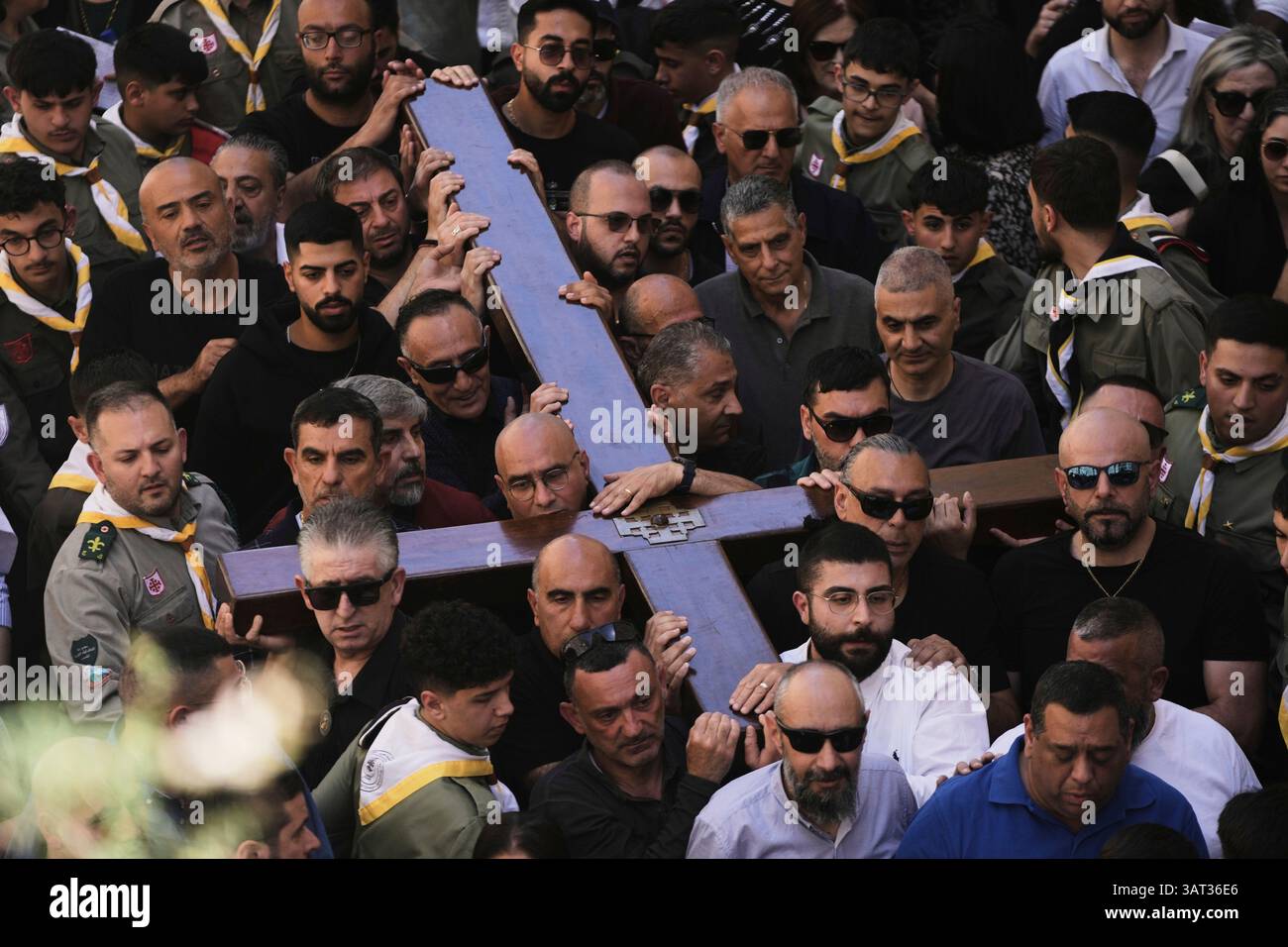 Christian pilgrims carry crosses during Good Friday procession in the ...