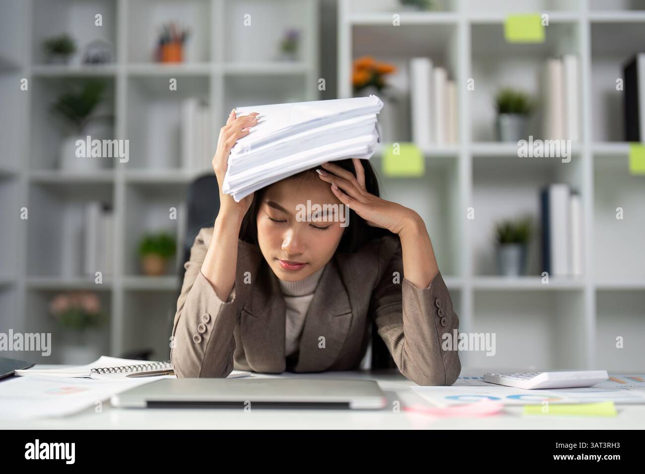 Office Stress and Overwhelm. A woman feeling overwhelmed by paperwork ...