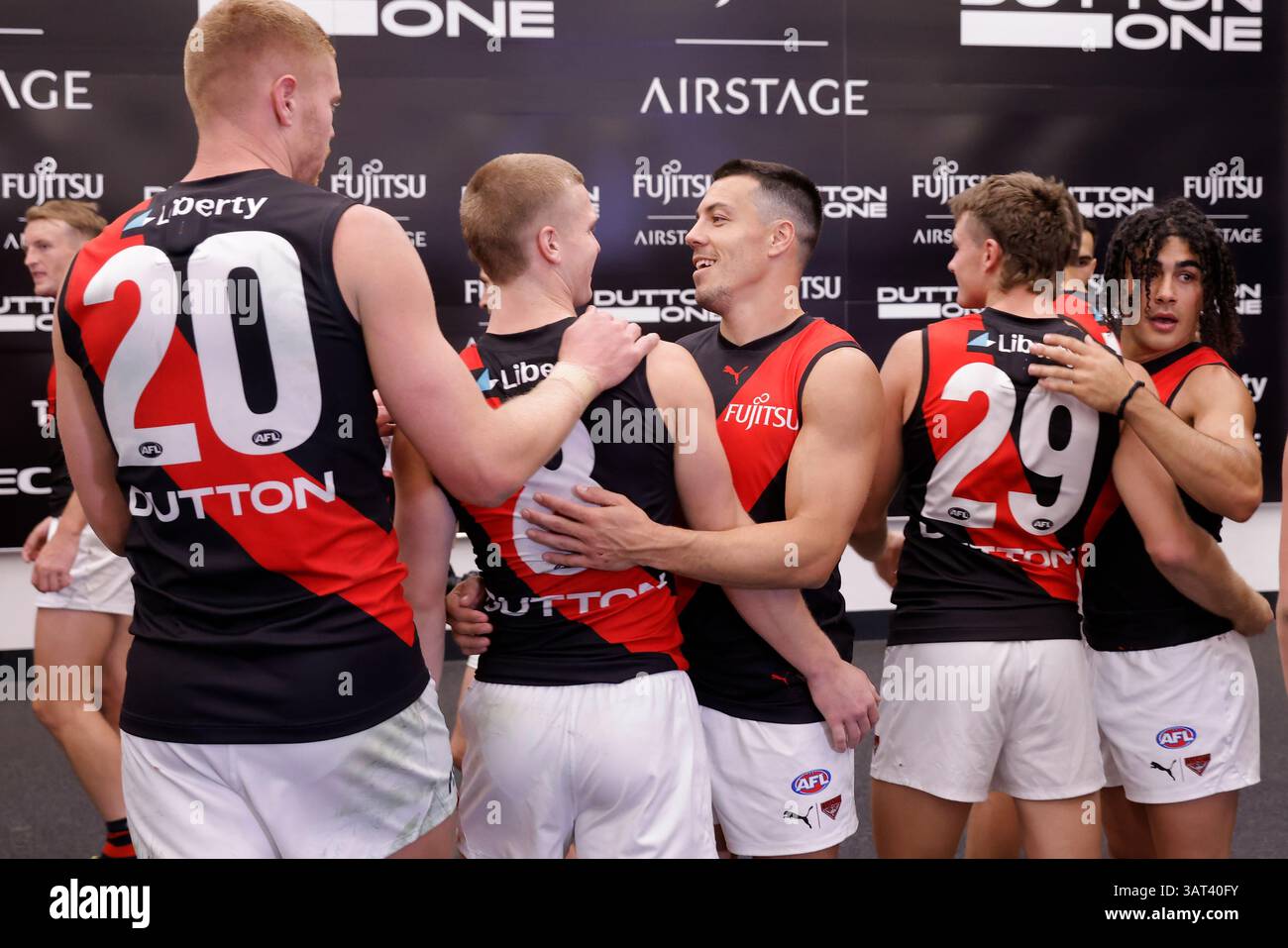 Bombers players celebrate after winning the AFL Round 6 match between ...