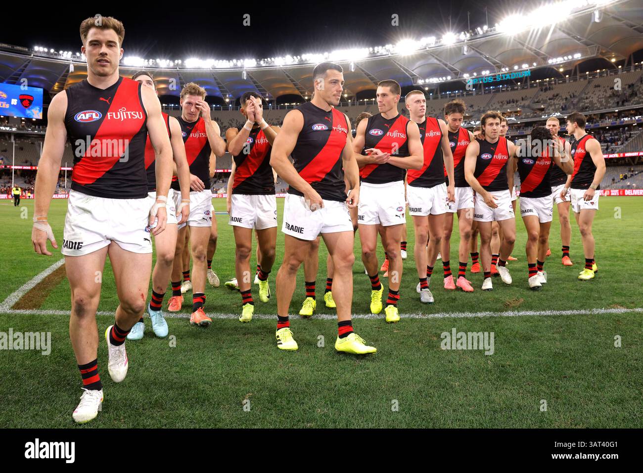 Bombers players leave the field after winning the AFL Round 6 match ...