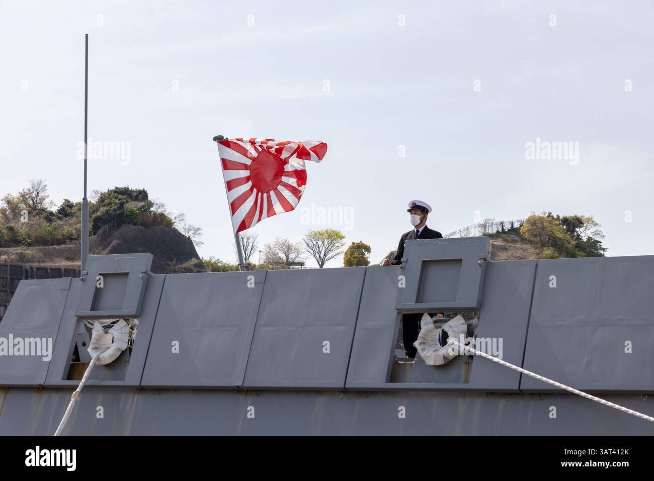Japanese Navy flag (Rising Sun Flag) flies on a ship inside the Japan ...