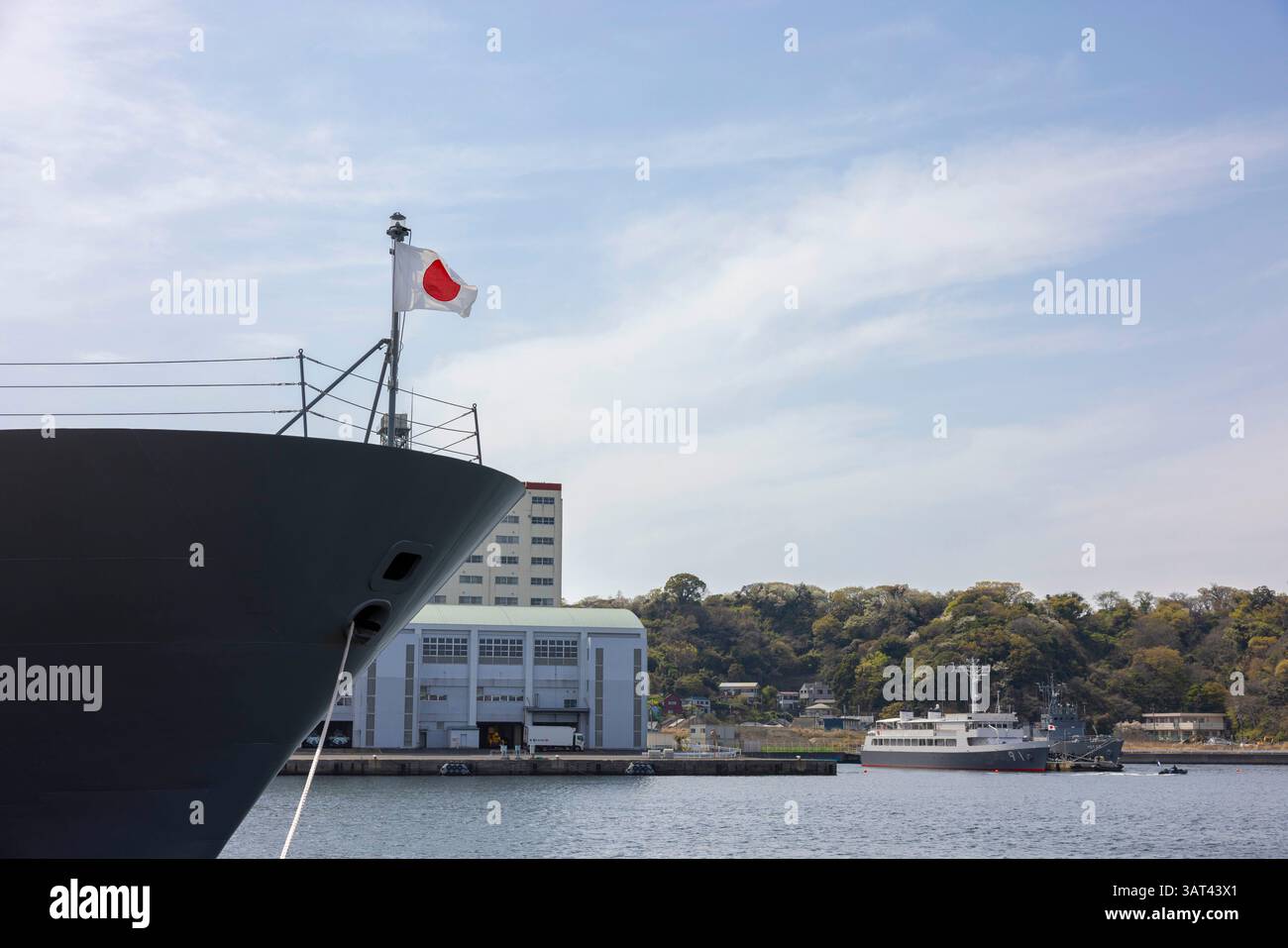 Japanese flag flies on a ship inside the Japan Maritime Self-Defense ...