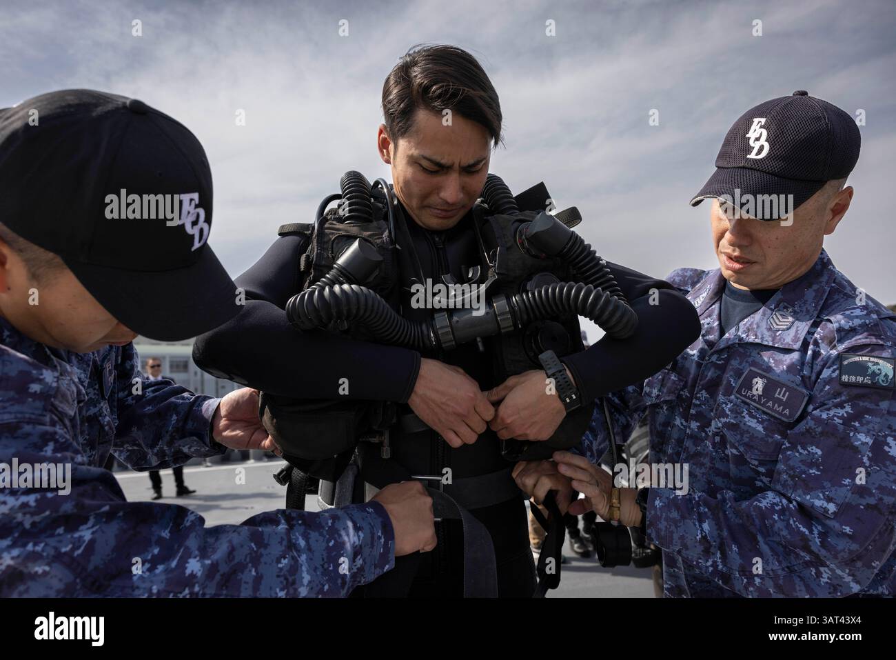 Diver of the Japanese Navy gets ready for a showcase during the visit ...