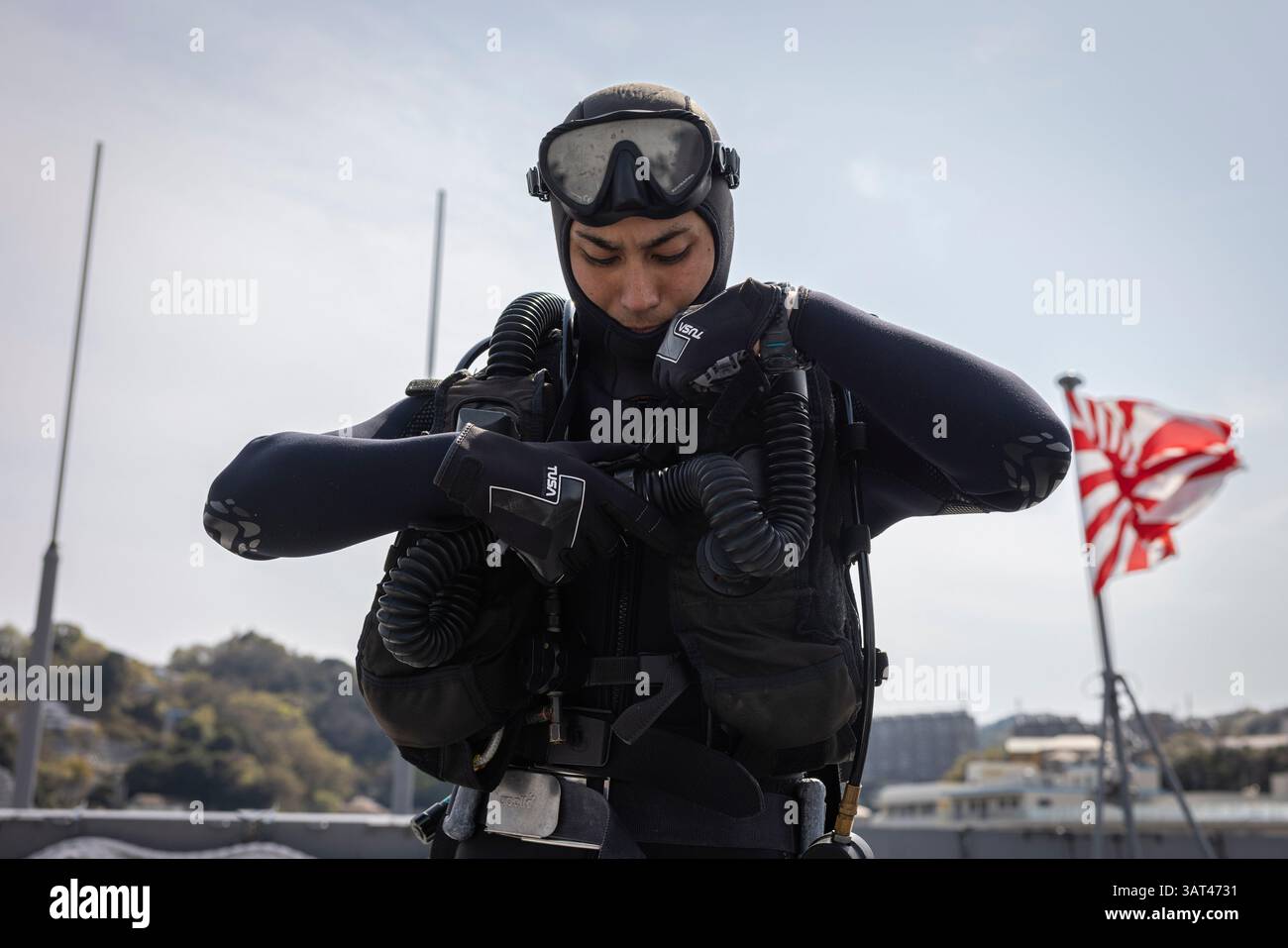 Diver of the Japanese Navy gets ready for a showcase during the visit ...