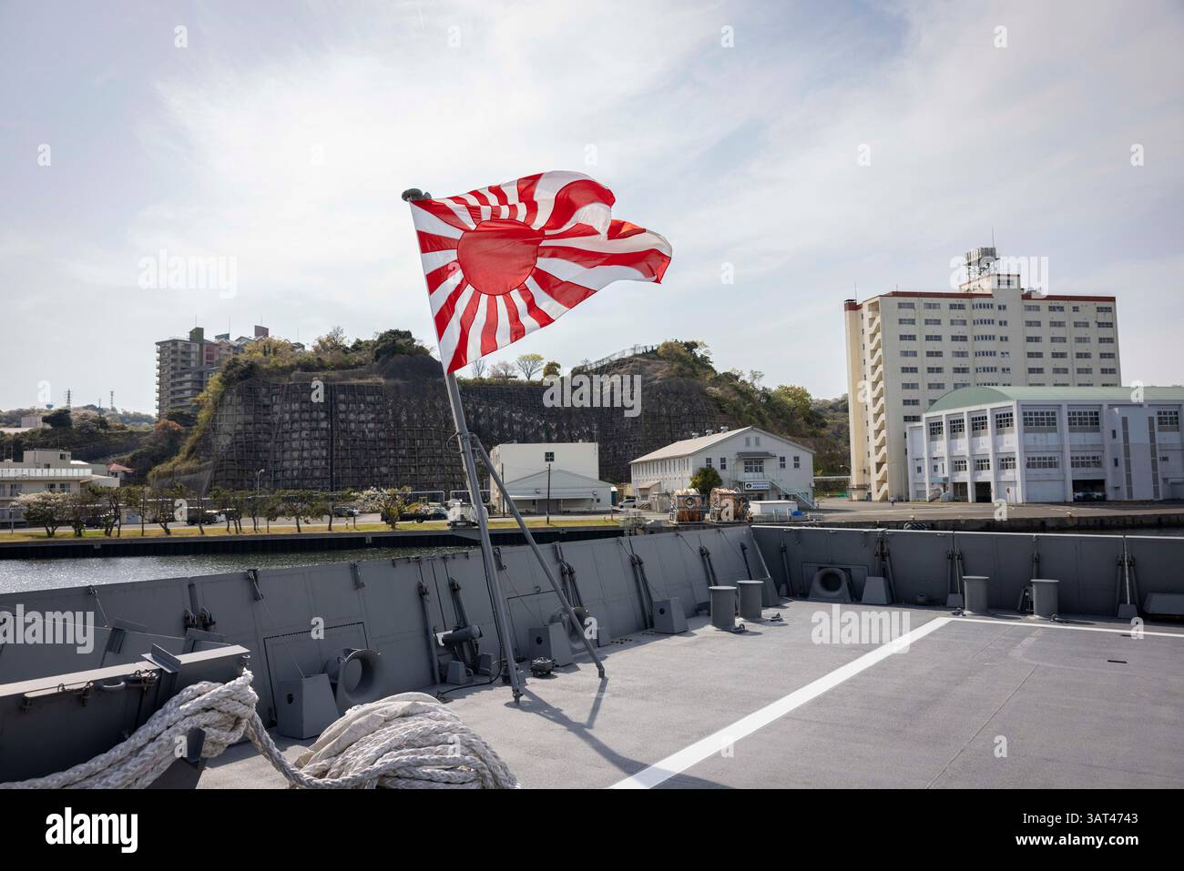 Japanese Navy flag (Rising Sun Flag) flies on a ship inside the Japan ...