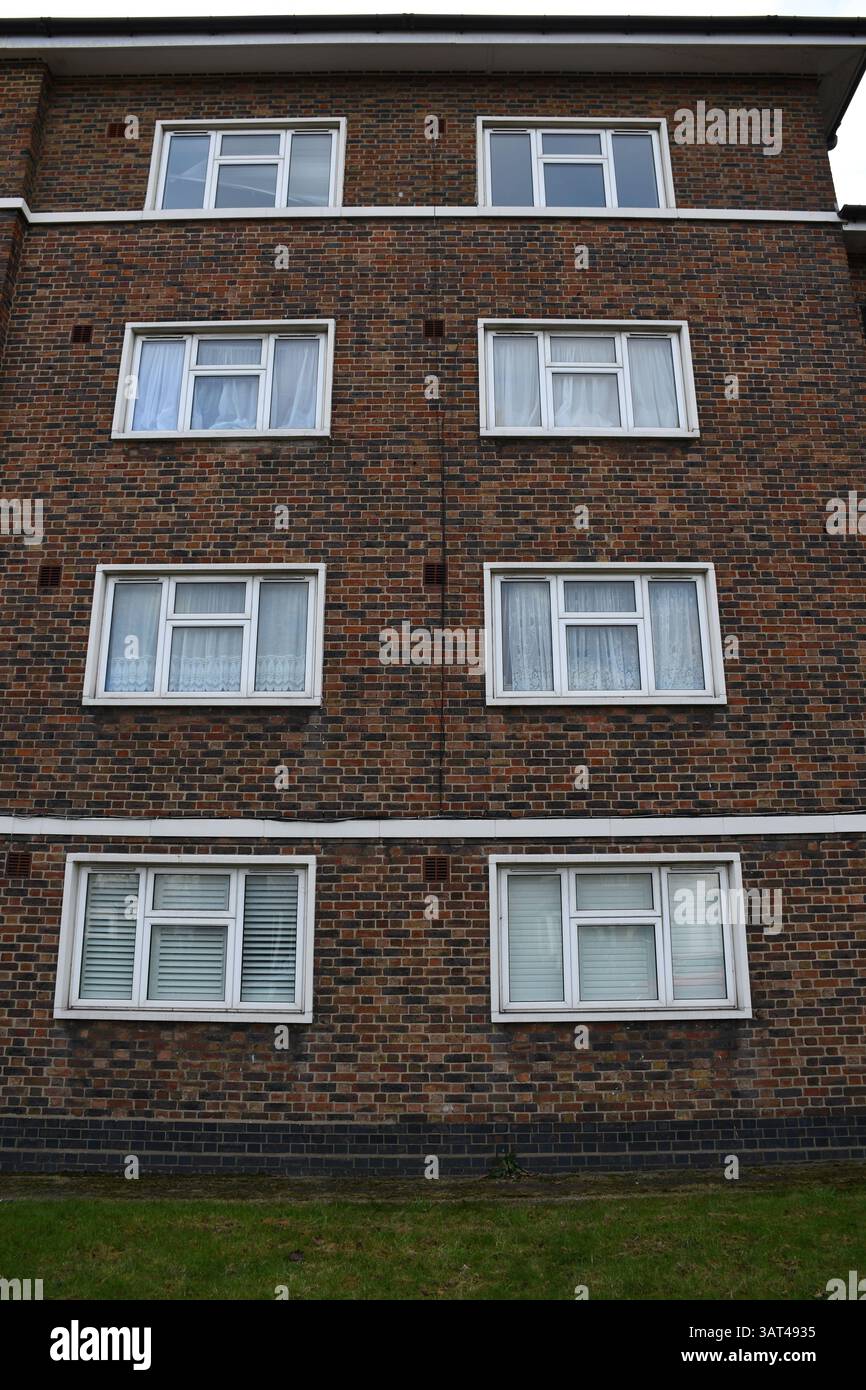 Block of flats, brick buildings with white windows, social housing ...