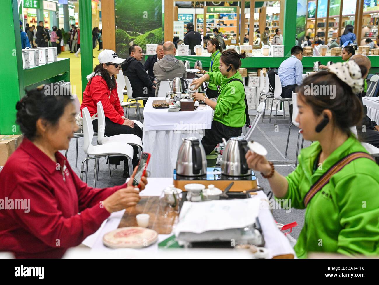 Beijing, China. 18th Apr, 2025. Visitors taste tea during the 18th ...
