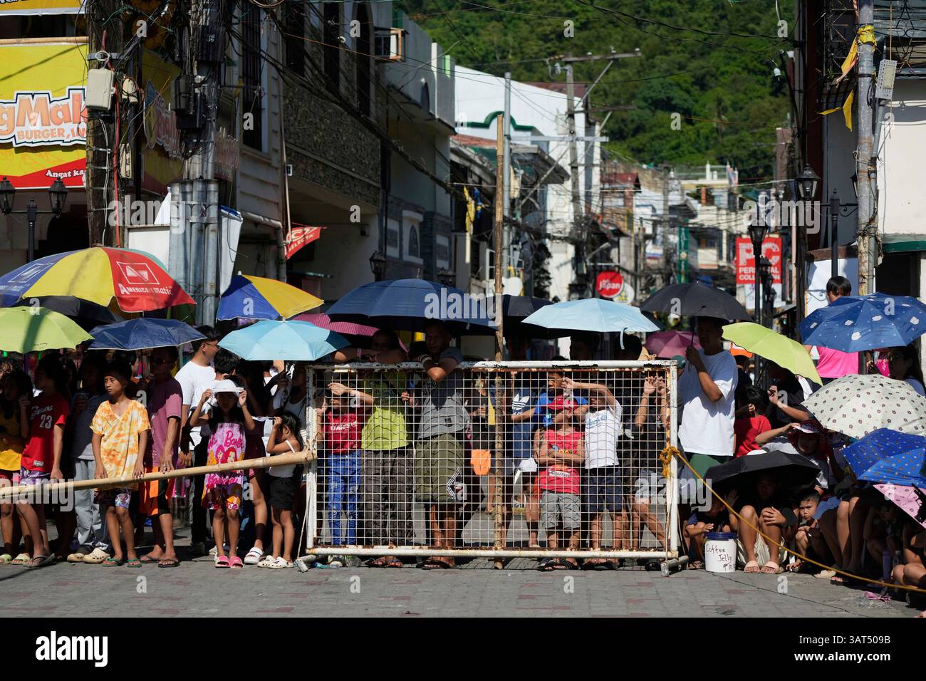People watch a reenactment of the crucifixion of Jesus Christ on Maundy ...