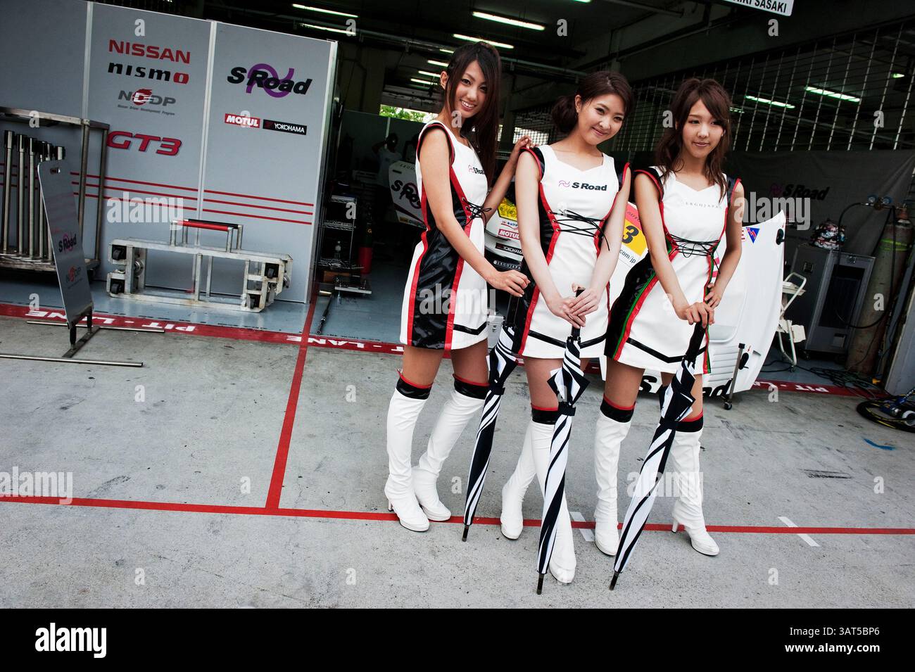 June 14, 2013 - Sepang, Malaysia - Race Queens pose outside their team ...