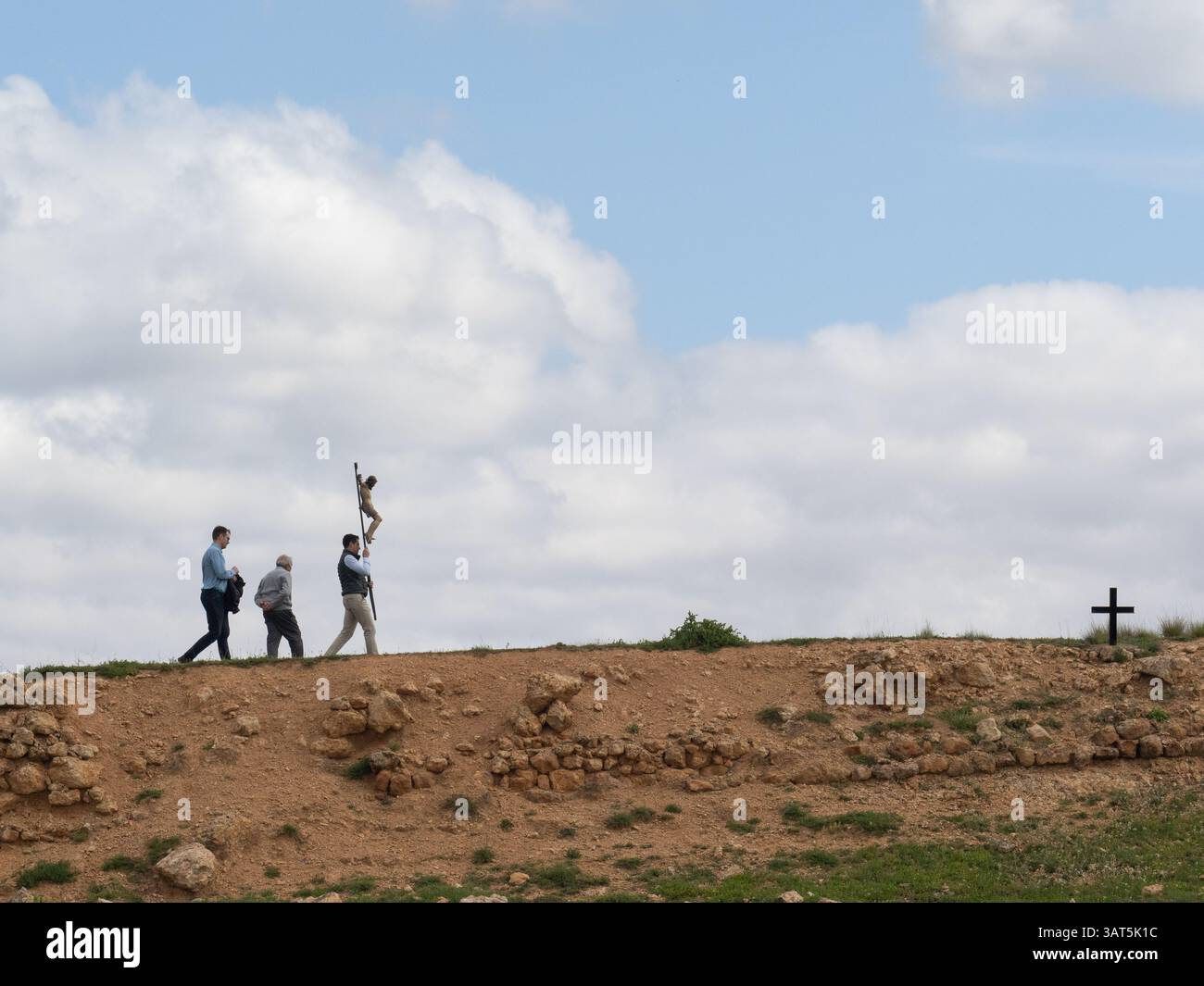 Cetina, Spain. 18th April, 2025. A man carrying a cross arriving to the ...