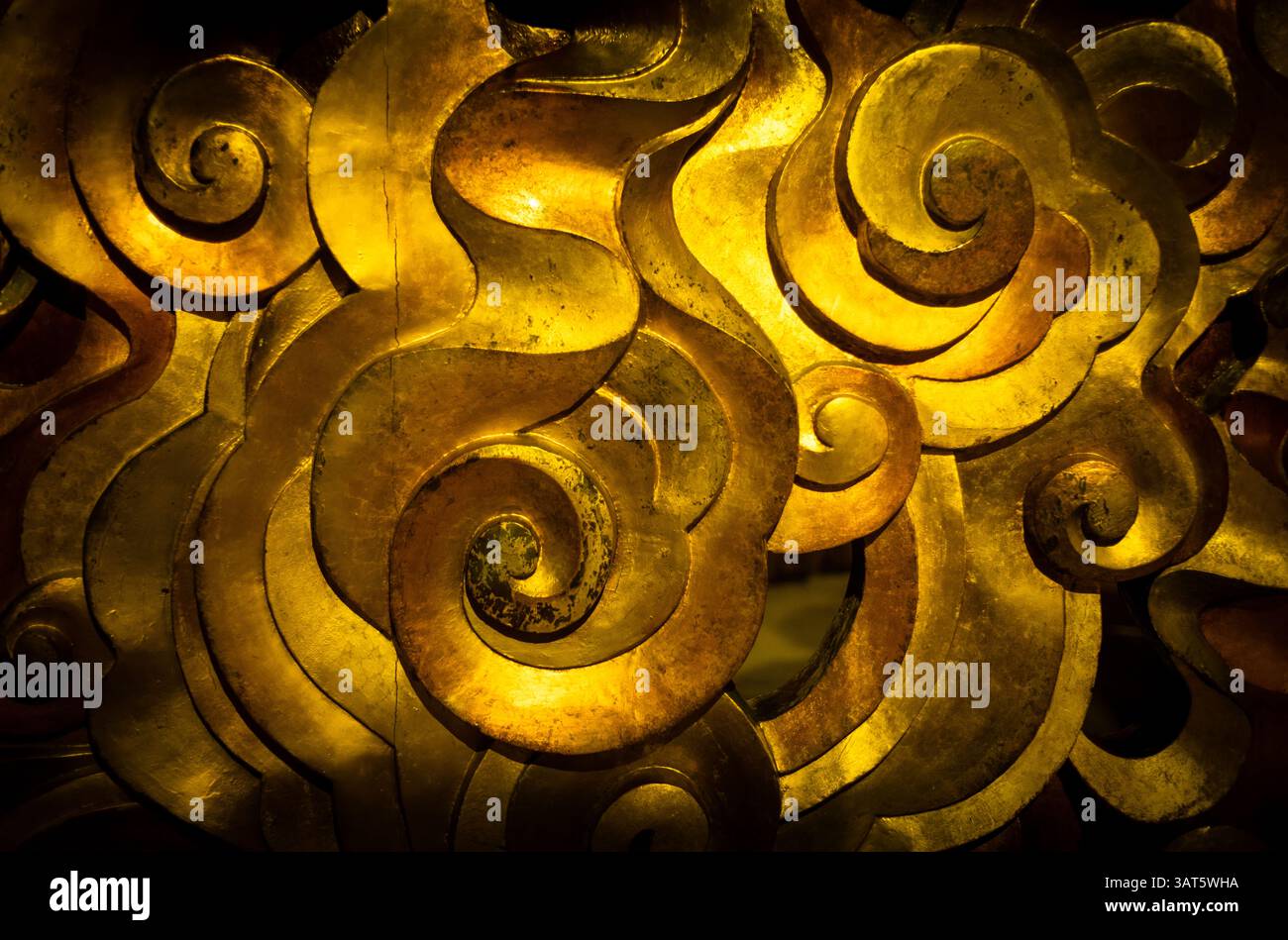 Traditional guilded carved swirling Vietnamese motifs on display with ...