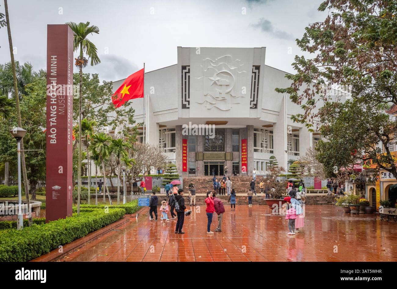 People in the rain outside the Socialist Realist main entrance to the ...